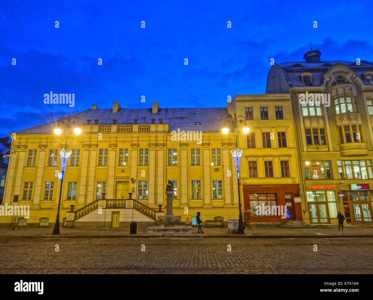 The building at Stary Rynek, captured at night, reflects the charm of ...