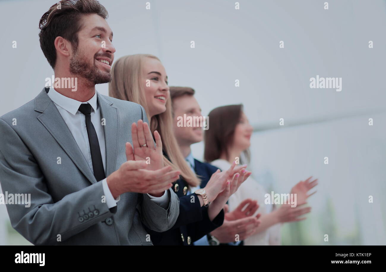 Satisfied proud business team clapping hands Stock Photo - Alamy
