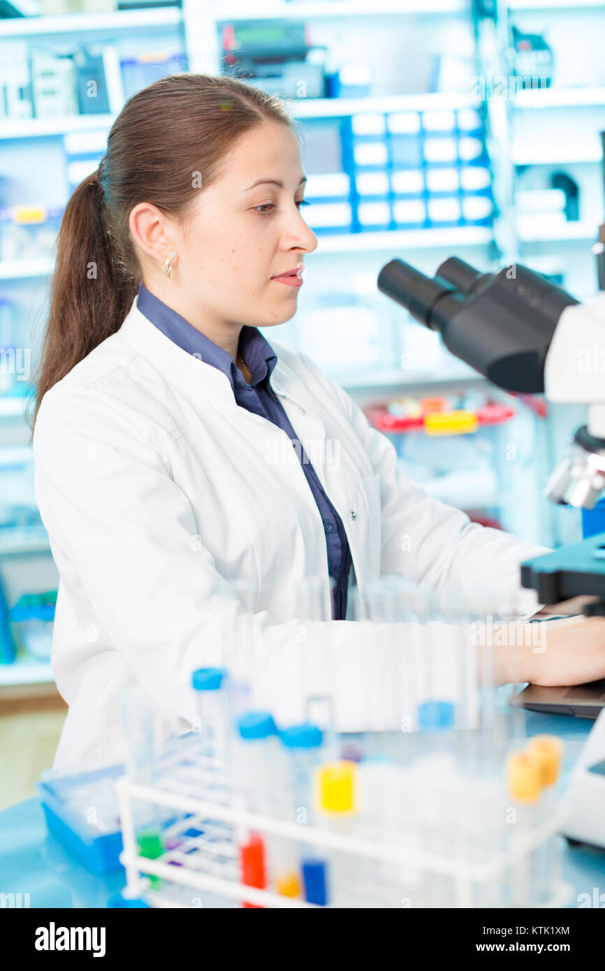 young woman lab assistant in a genetics lab Stock Photo - Alamy