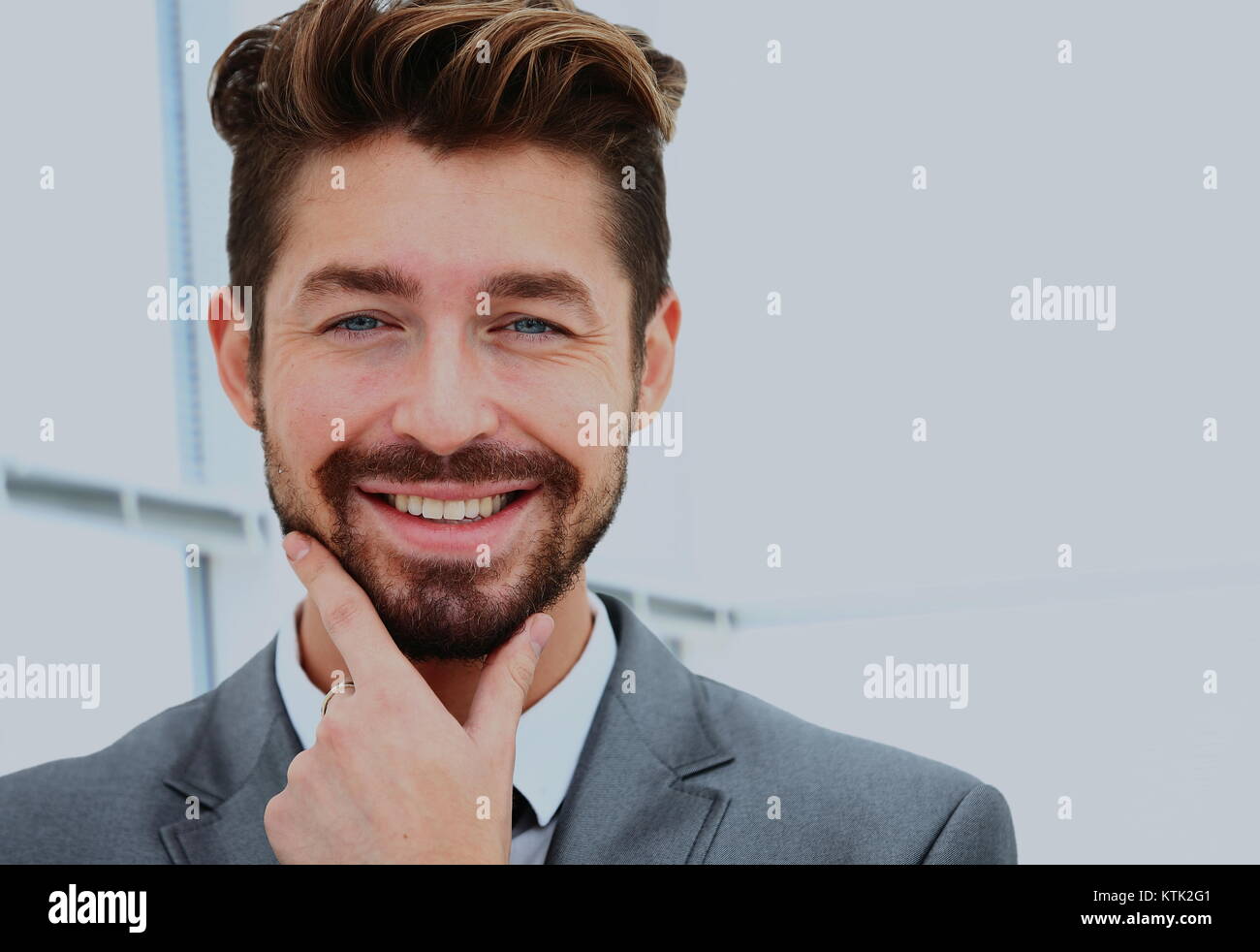 Man smiling in the office Stock Photo - Alamy