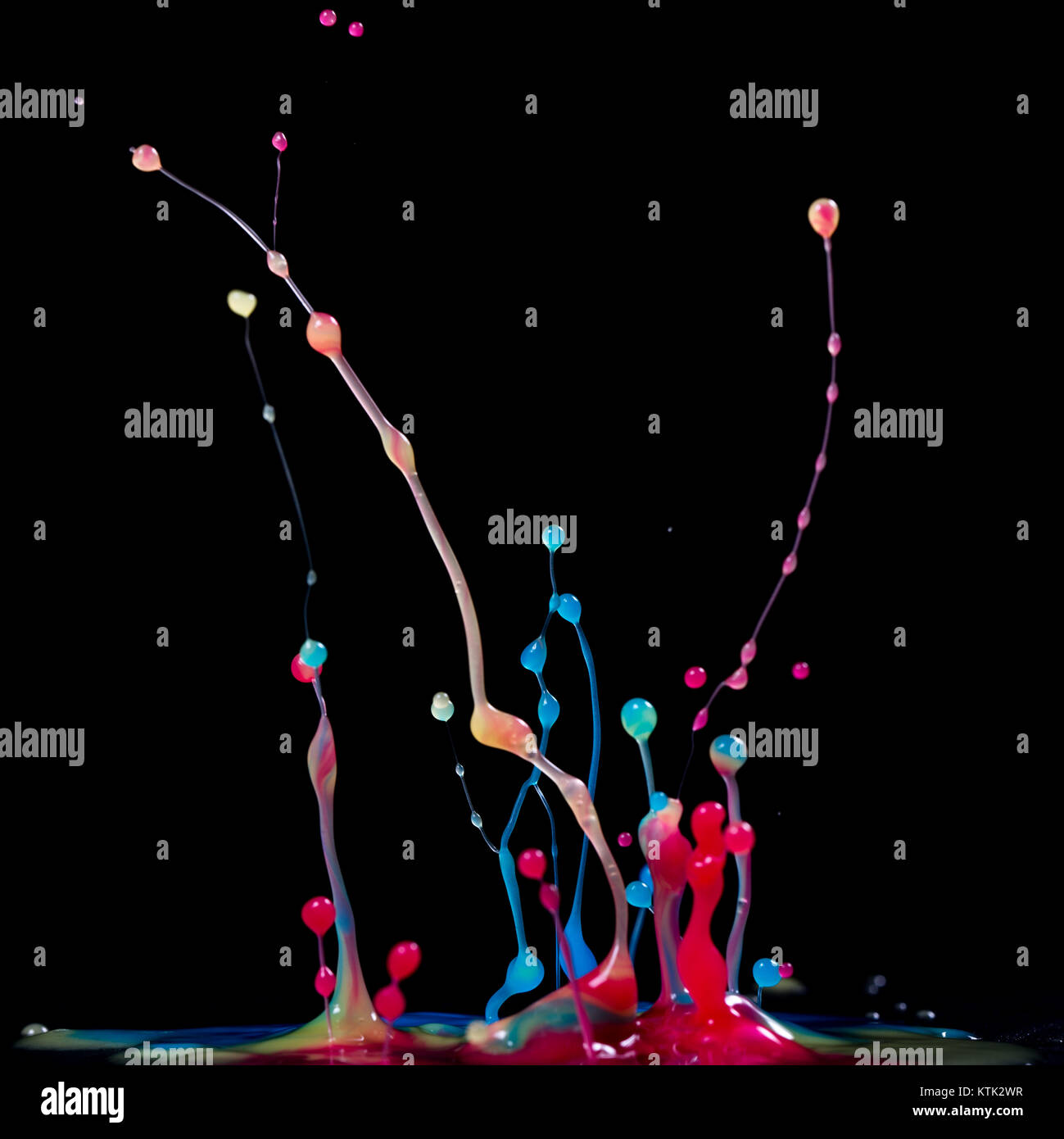 explosion of splashes and bursts of colour fluid paint or ink on a ...