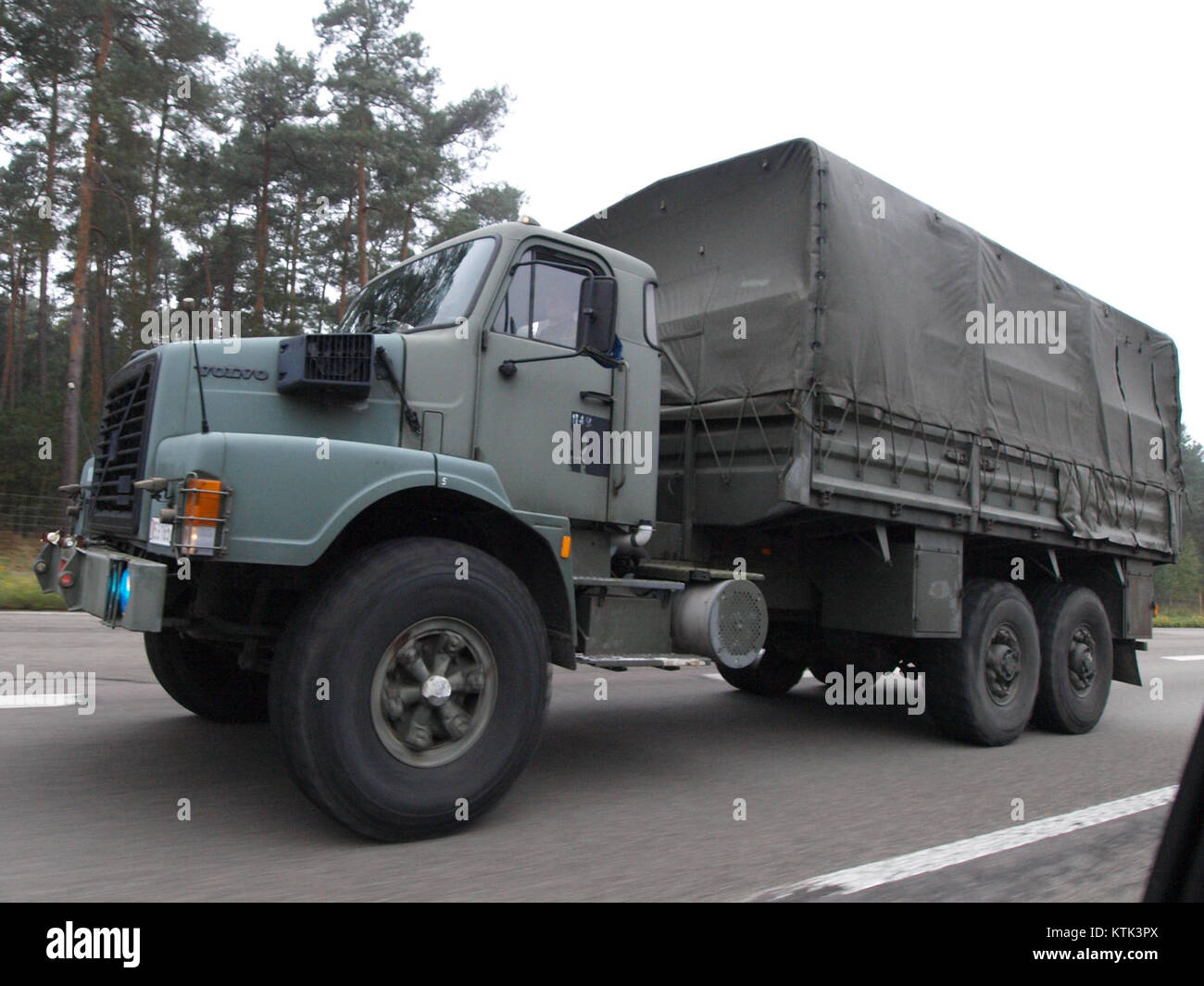 A Belgian Volvo army truck is seen on the German Autobahn, reflecting ...