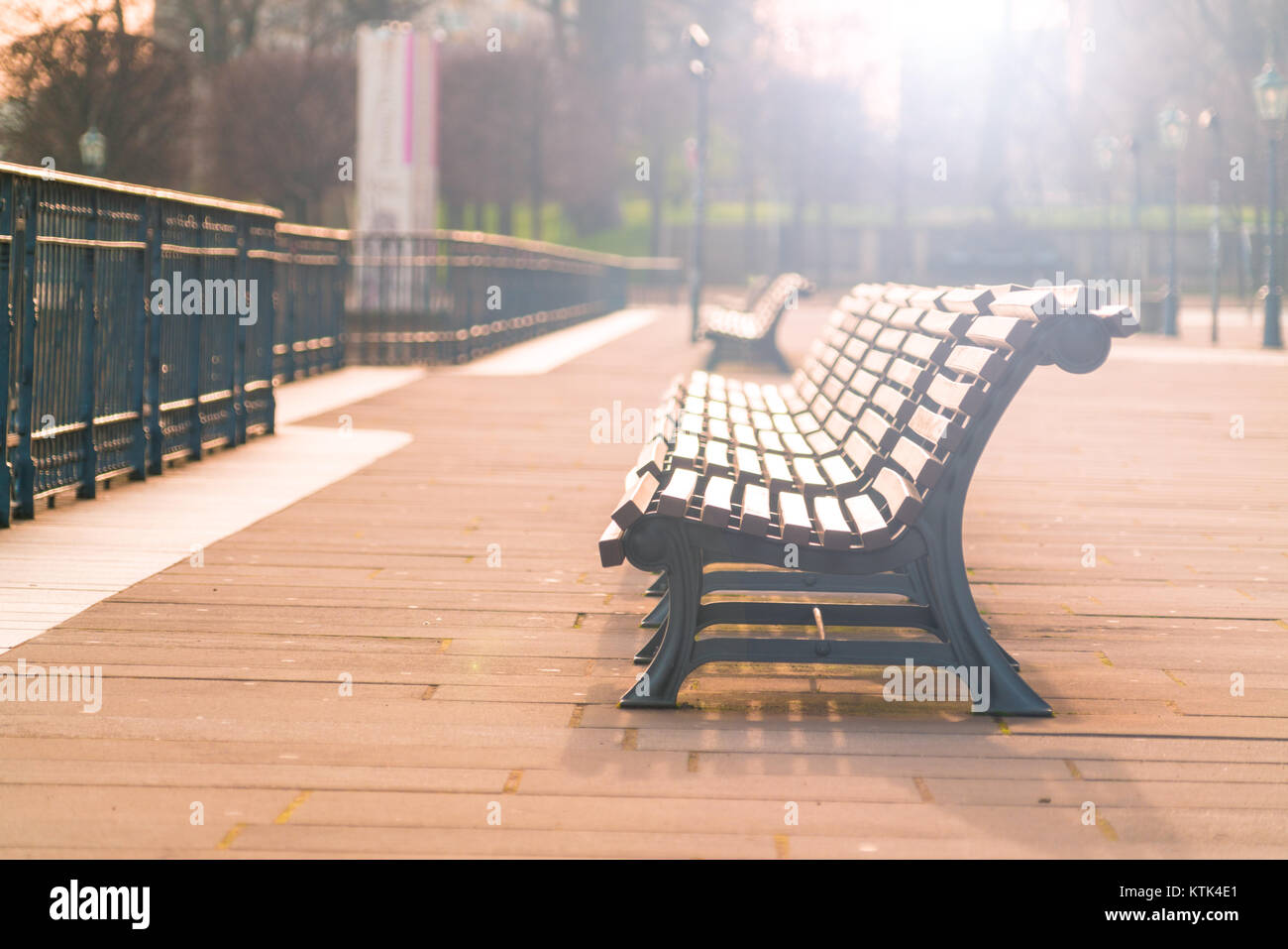 Wooden bench in the city Stock Photo - Alamy