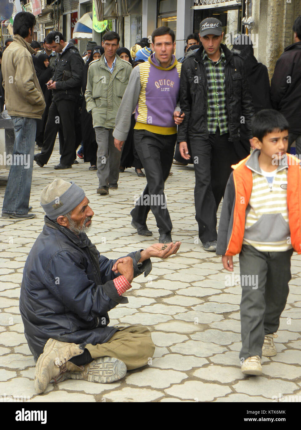 This image likely portrays a scene of homelessness or poverty ...