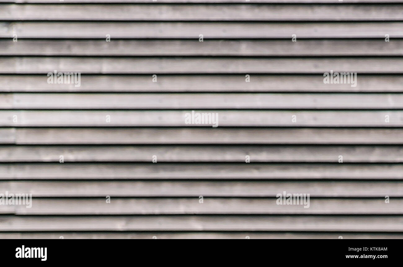 Linear patterned wooden exterior wall texture background in grey colors ...