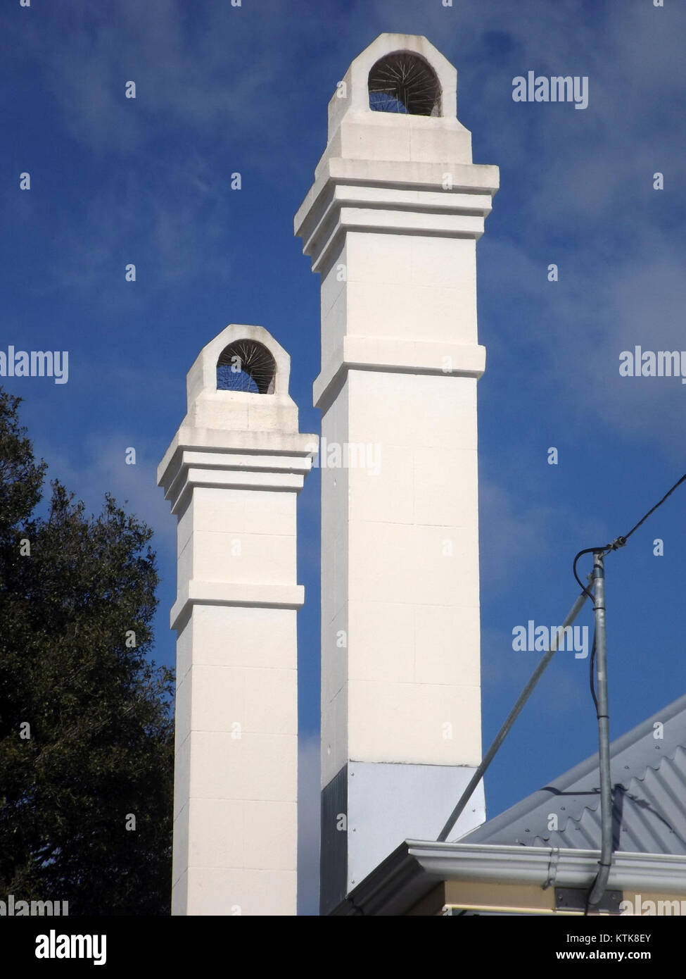 The image depicts chimneys of the brick cottages on Bess Street ...
