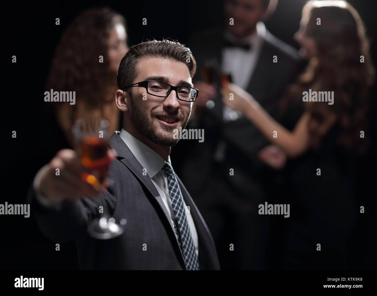 elegant man raising his glass with the toast Stock Photo - Alamy