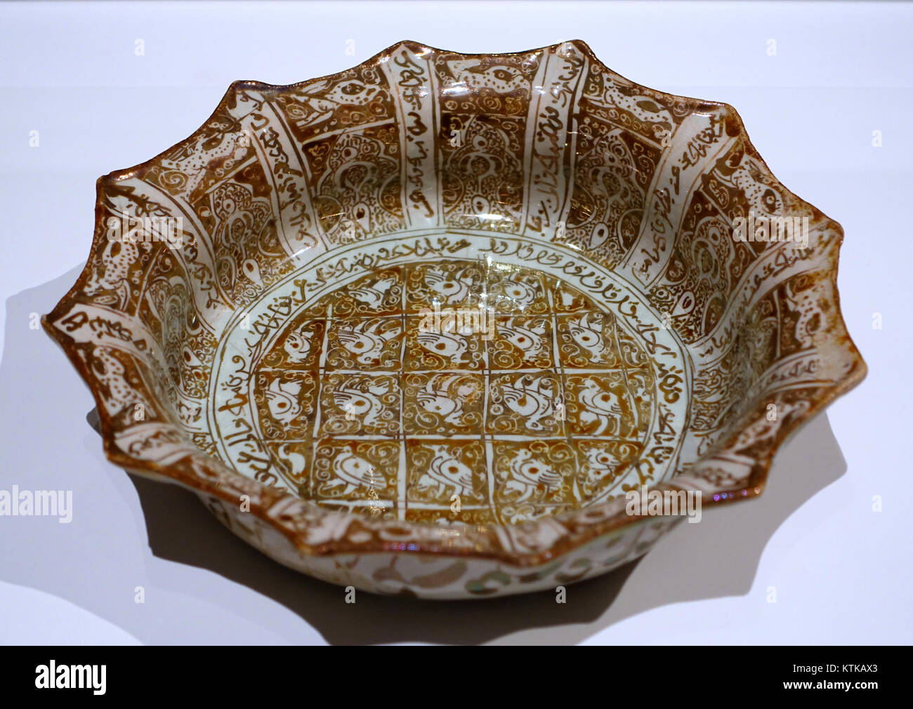 This 13th-century Iranian basin features lustre-painted fritware ...
