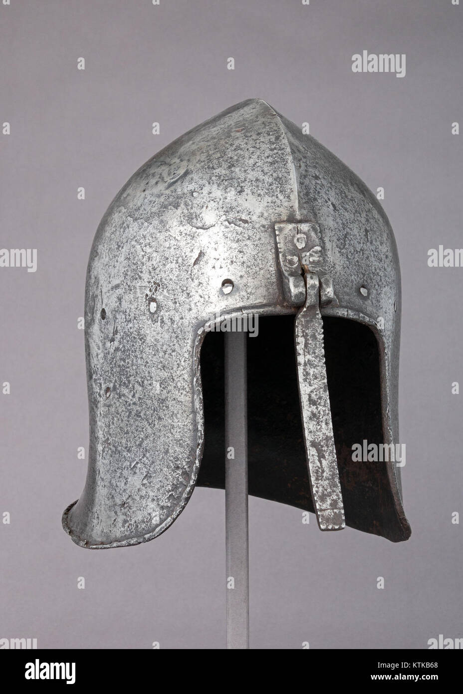 The barbute with hinged nasal is a type of medieval helmet featuring a ...