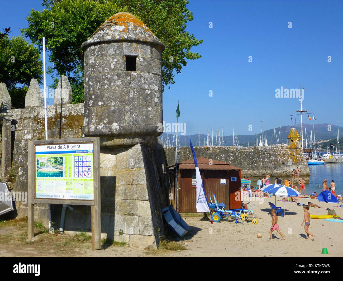 A scenic view of Praia da Ribeira beach in Baiona, Spain, known for its ...