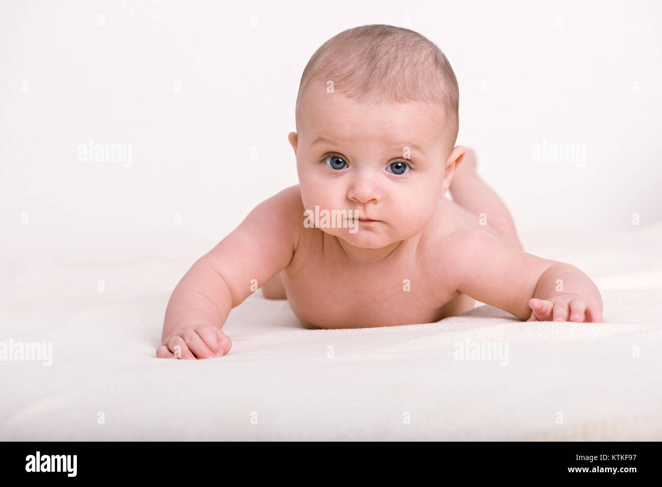Bright portrait of a sweet little 5 months old baby boy looking up ...