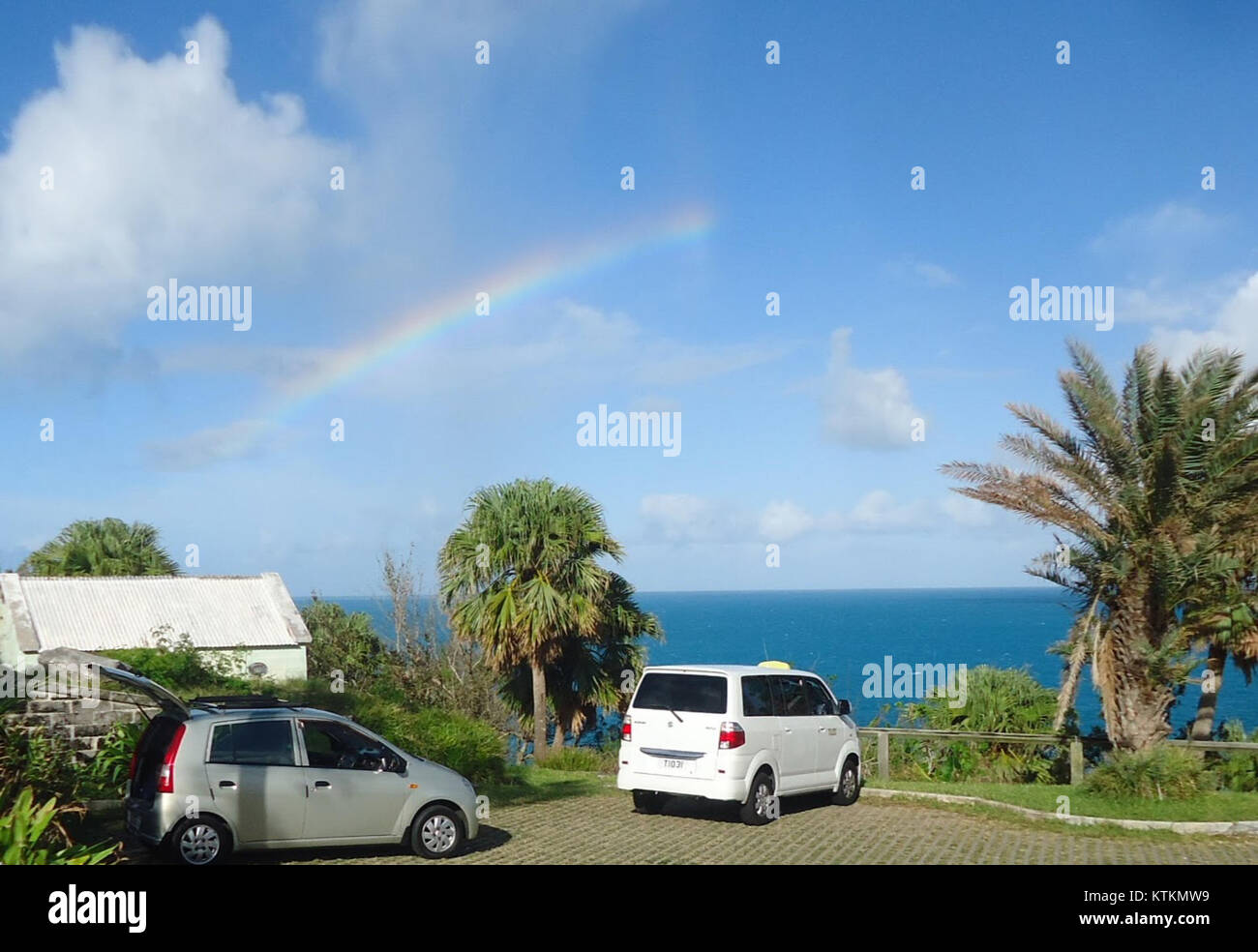A photograph taken in Bermuda shows a rainbow in the distance, a ...