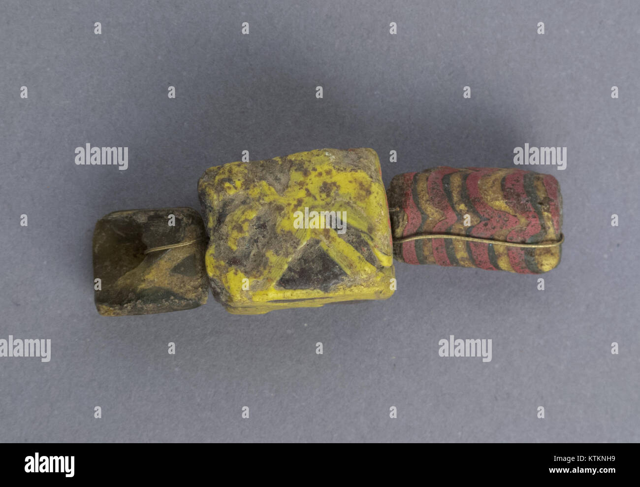 A collection of three beads, displayed at the MET, reflecting ancient ...