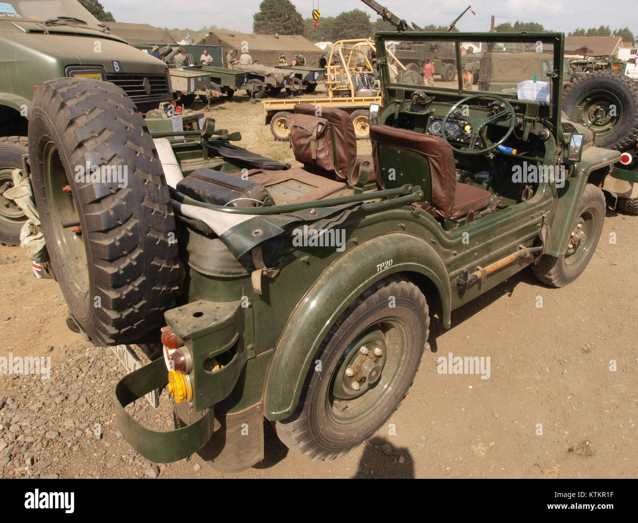 This image features an Austin Champ military vehicle with a German ...