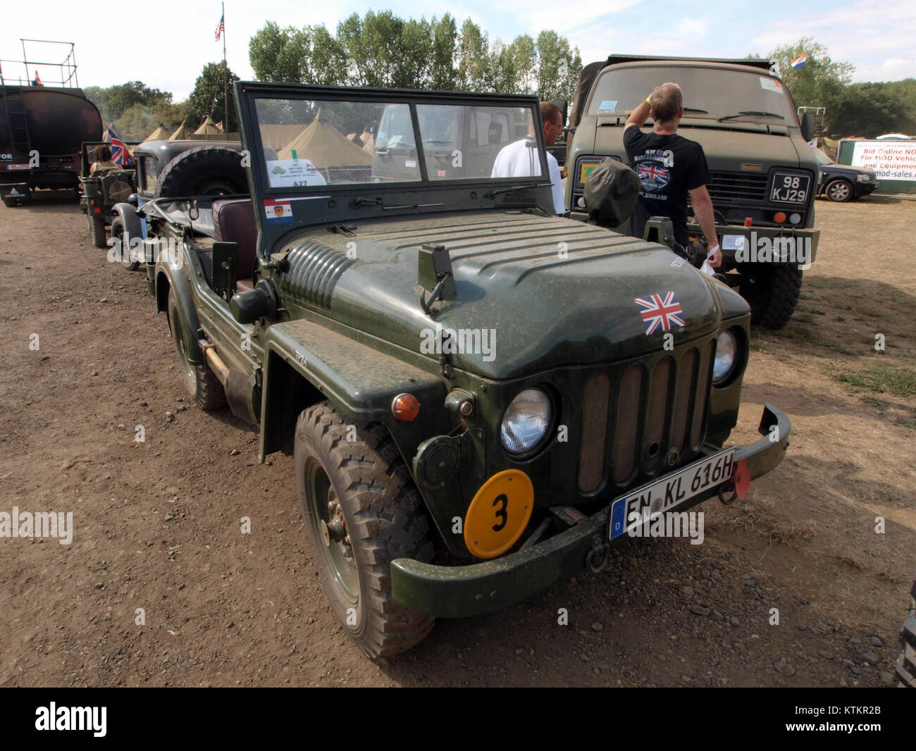 This image features an Austin Champ, a British military vehicle, with a ...