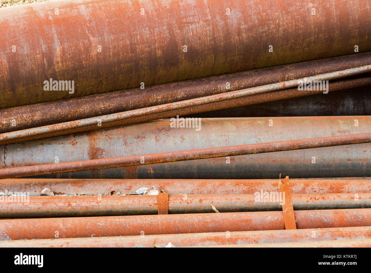 An assortment of rusty pipes, likely showcasing the effects of time and ...