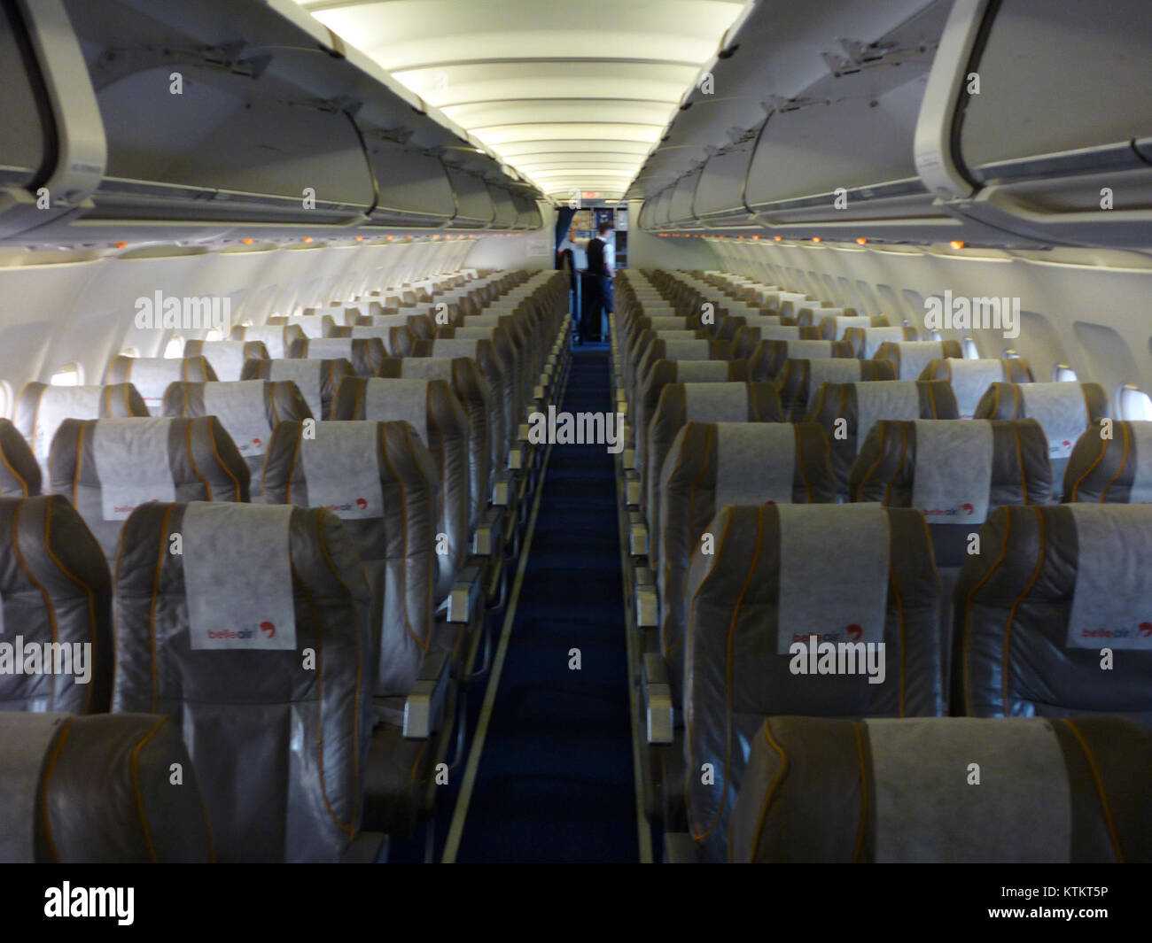 The image depicts the interior cabin of an Airbus A320 aircraft ...