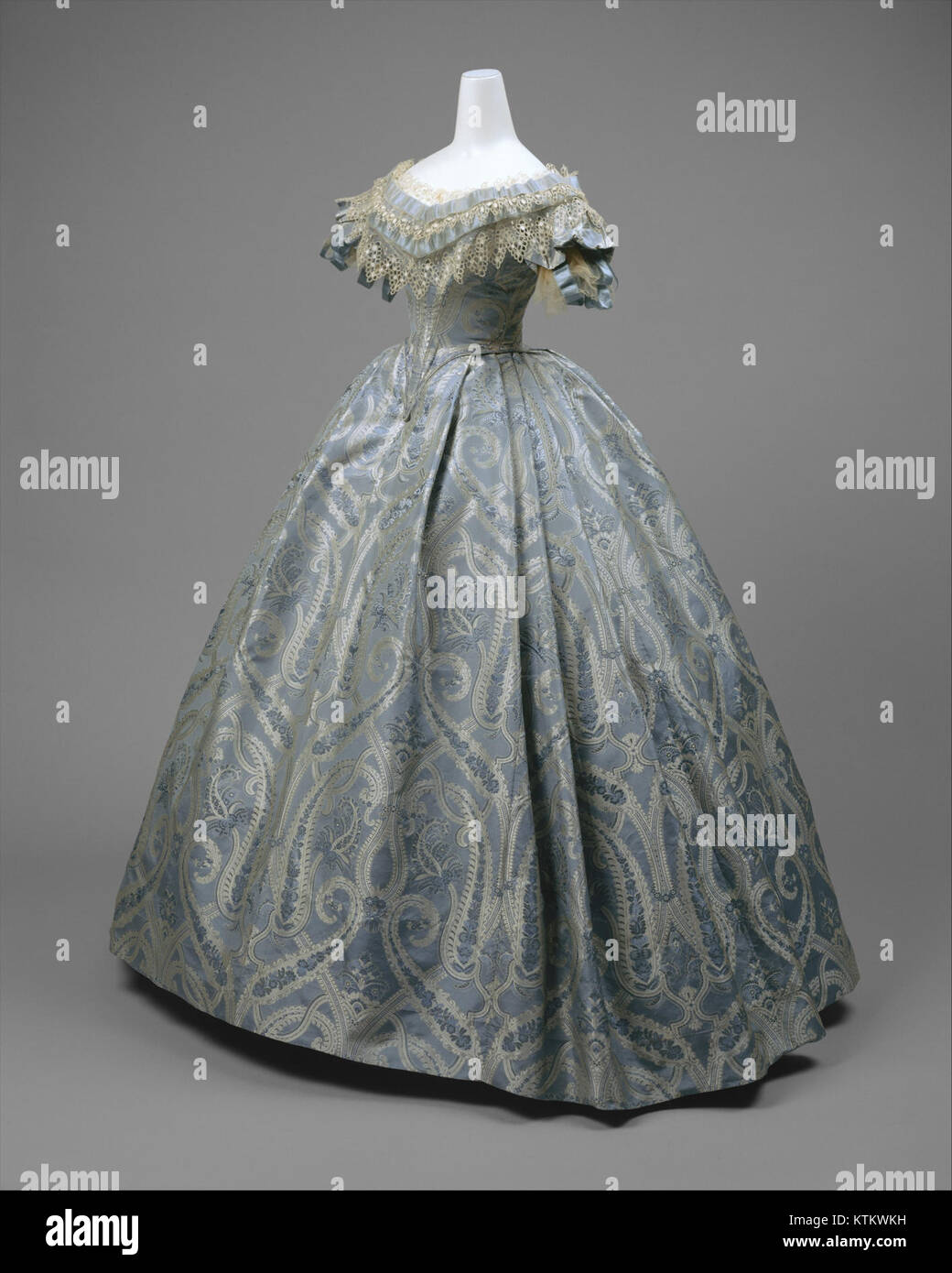 This ball gown, displayed at the Metropolitan Museum of Art, represents ...