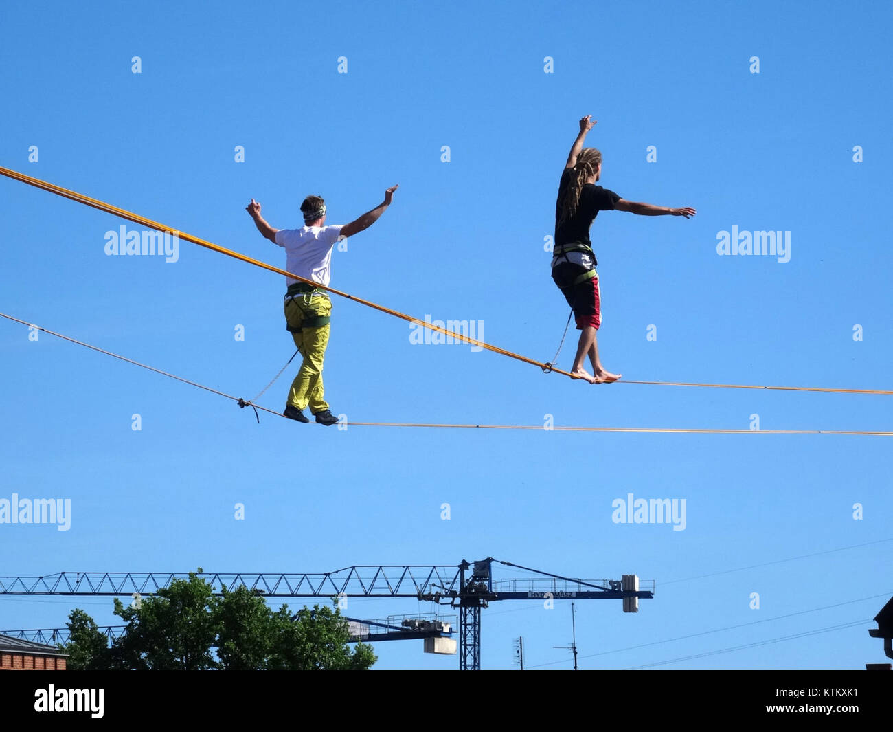 The image captures the exciting action at a Slackline Games event ...