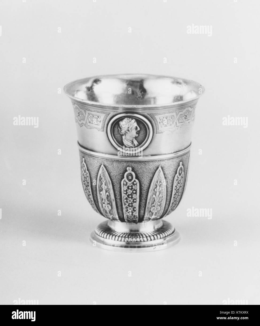 This beaker, part of a pair, is an example of ancient craftsmanship. It ...