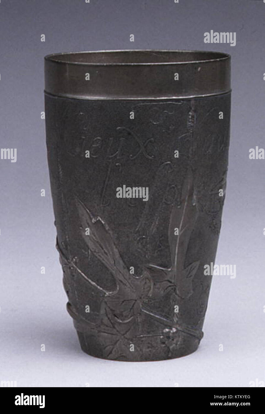 This beaker, part of an ancient collection, is made from ceramic and ...