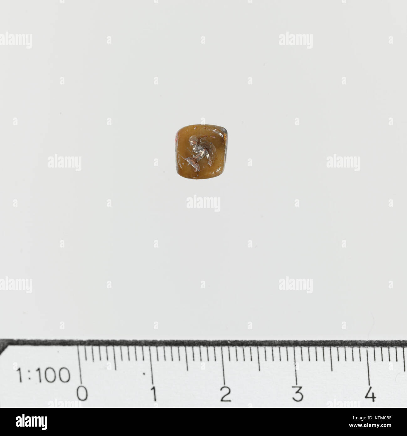 A three-sided bead from the MET collection, known for its unique shape ...