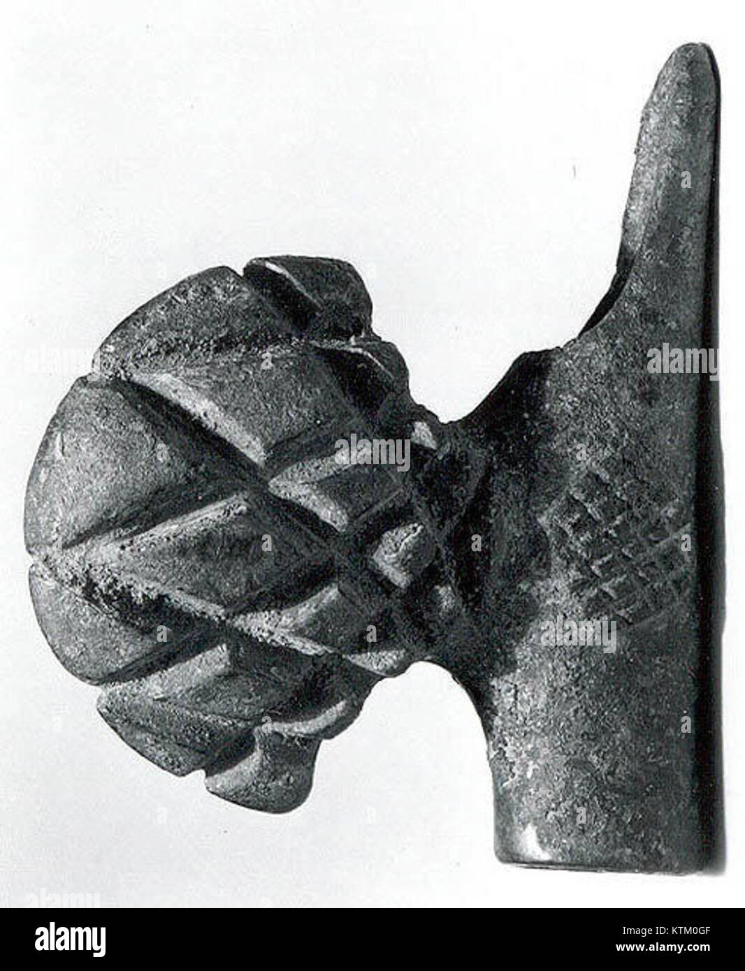 The axe or mace head, housed in the MET collection, is a historical ...