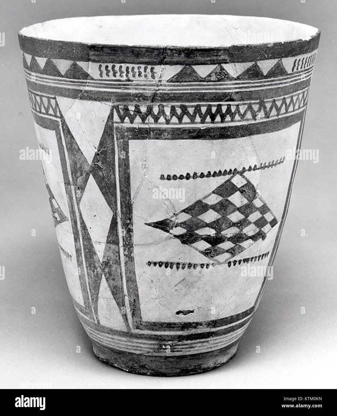 The Beaker with a checkerboard design (MET hb48 98 91) is a historical ...