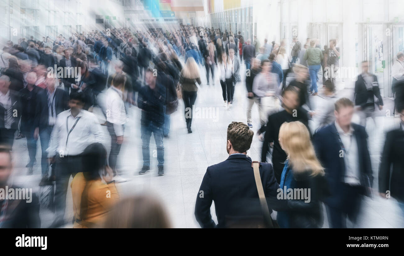 Large crowd of business people at a trade fair Stock Photo - Alamy