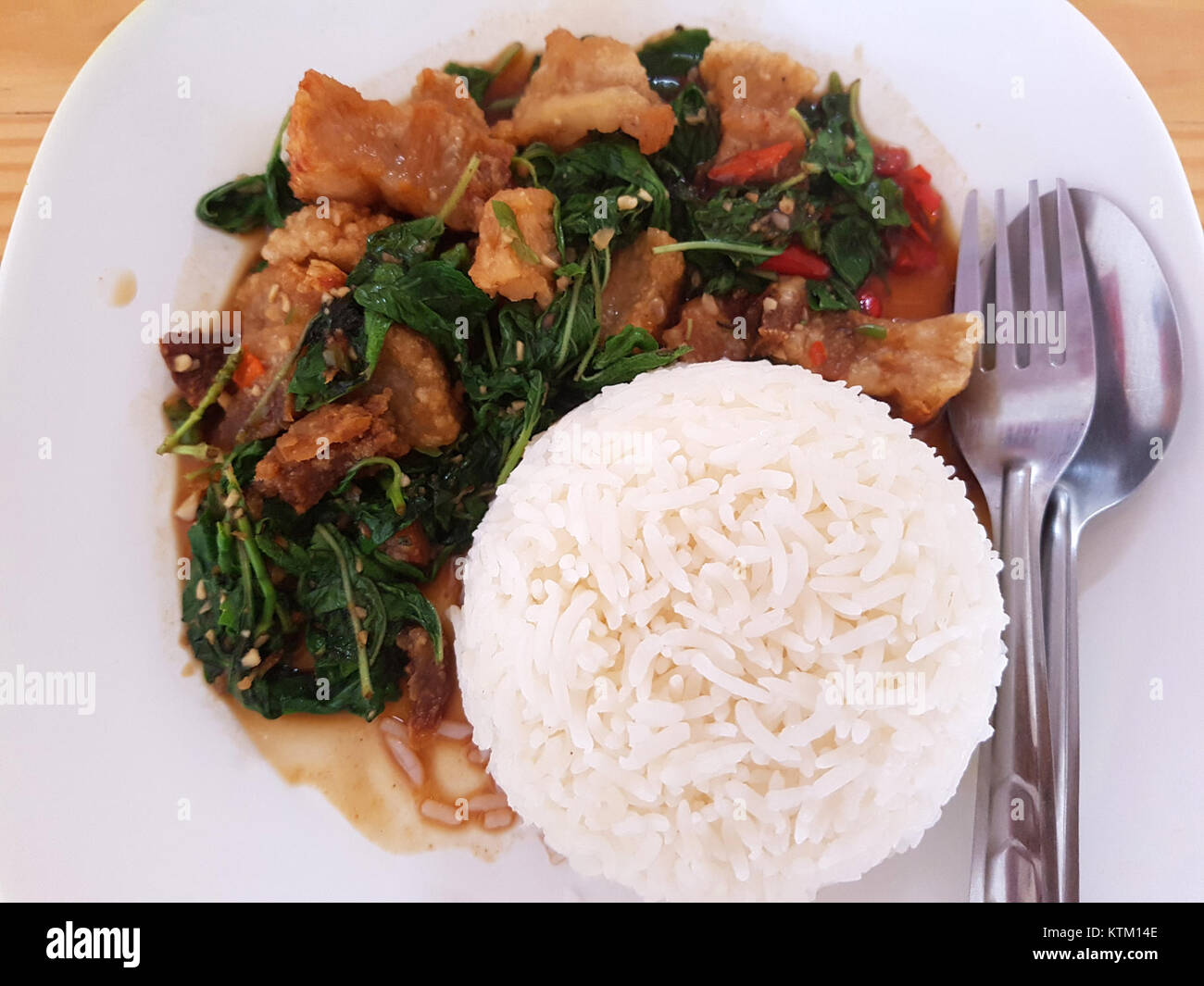 Basil fried crispy pork with rice, photographed in Chiang Mai in 2017 ...