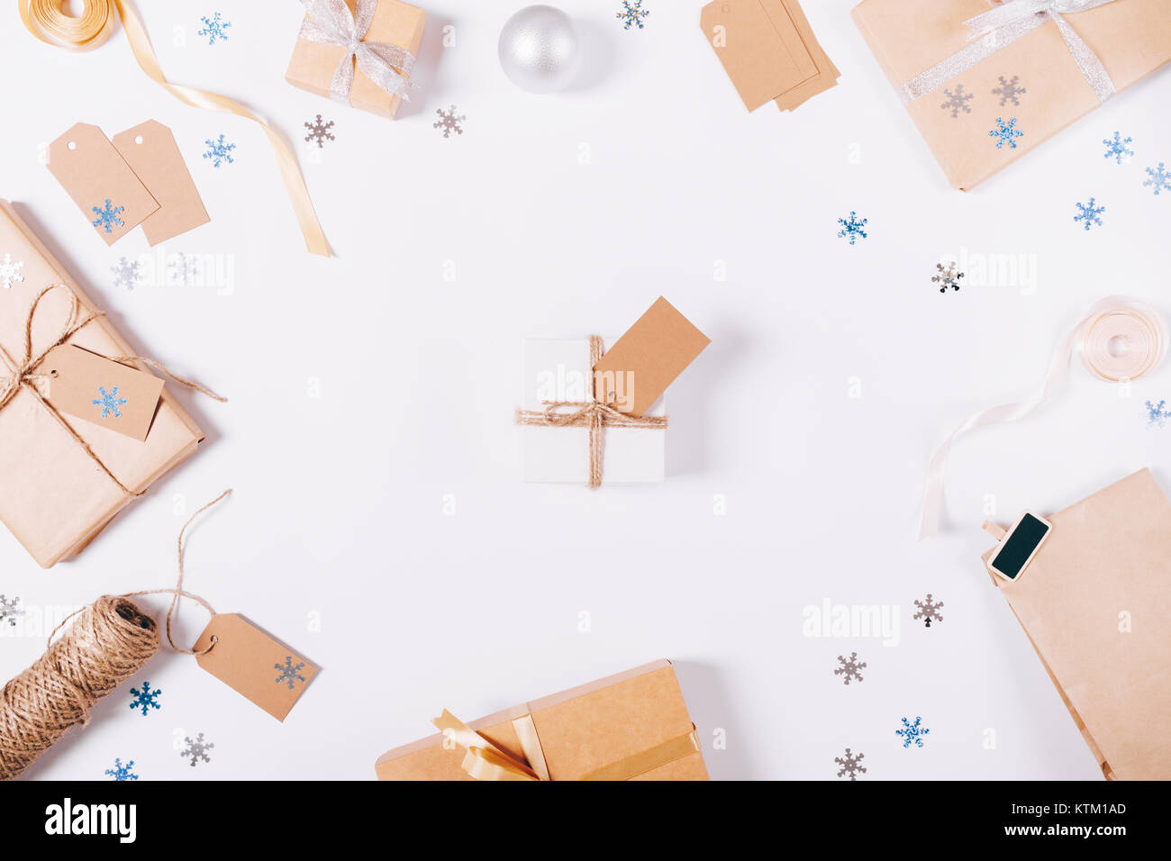 Top view Christmas decorations and boxes with gifts on a white table ...