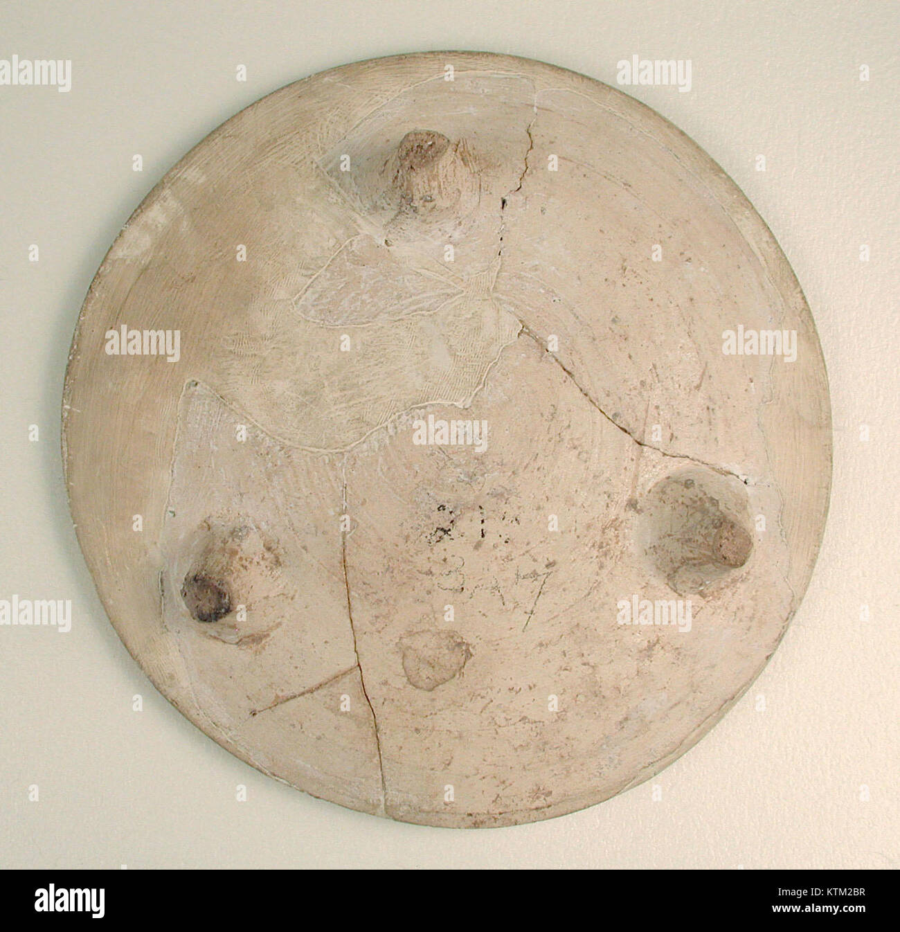 This artifact is the base of a footed buff ware vessel from the ancient ...