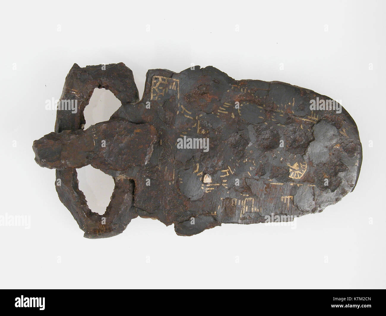This is a belt buckle attachment plate, cataloged in the MET collection ...