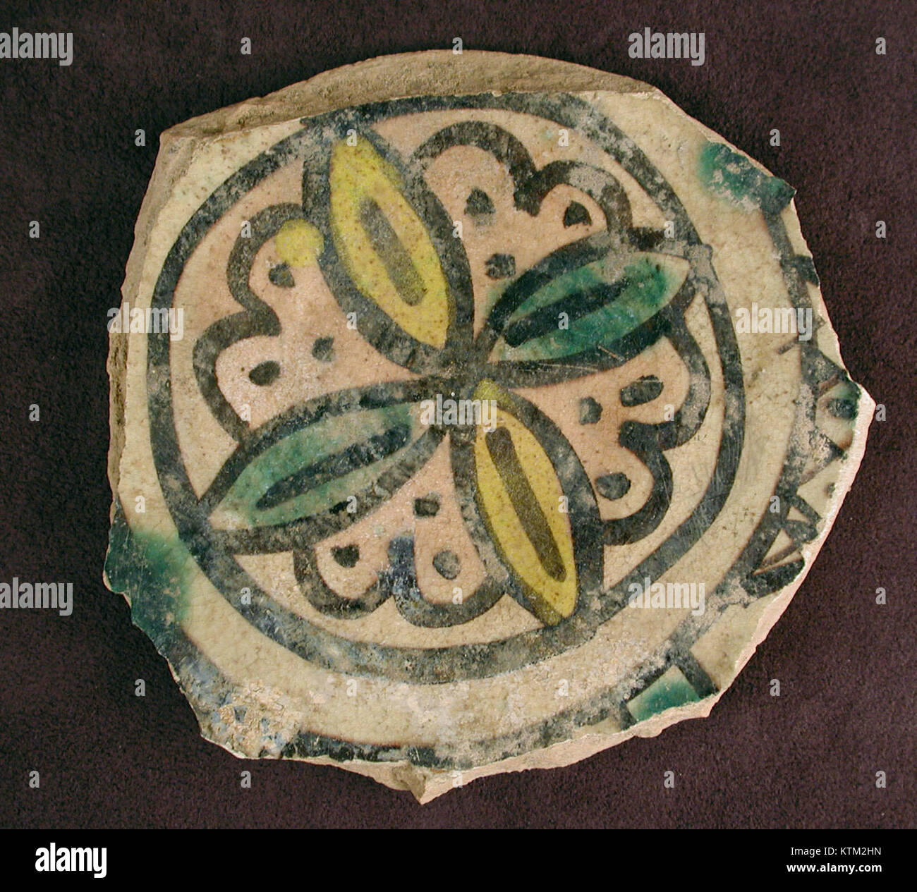 This artifact is the base of a Buff Ware vessel, an example of ancient ...