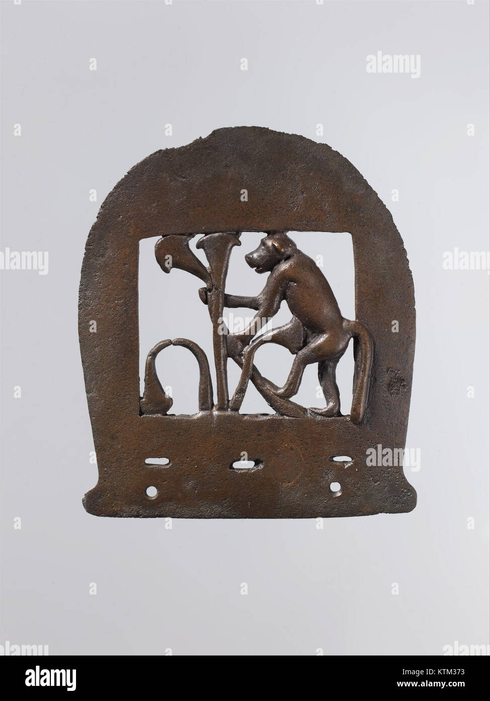 This artifact, an ax head with a monkey figure, is a unique historical ...