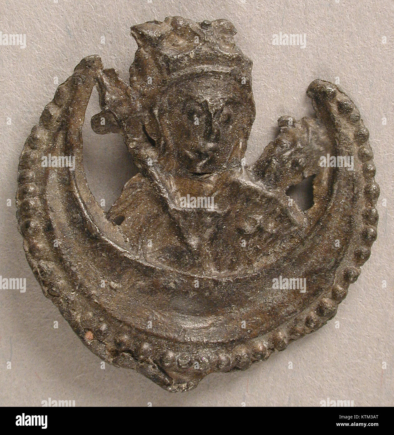 A religious badge featuring the Madonna and Infant, an iconic Christian ...
