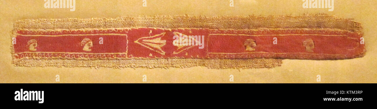 A fragmentary artwork featuring a band design with a mask and lotus ...