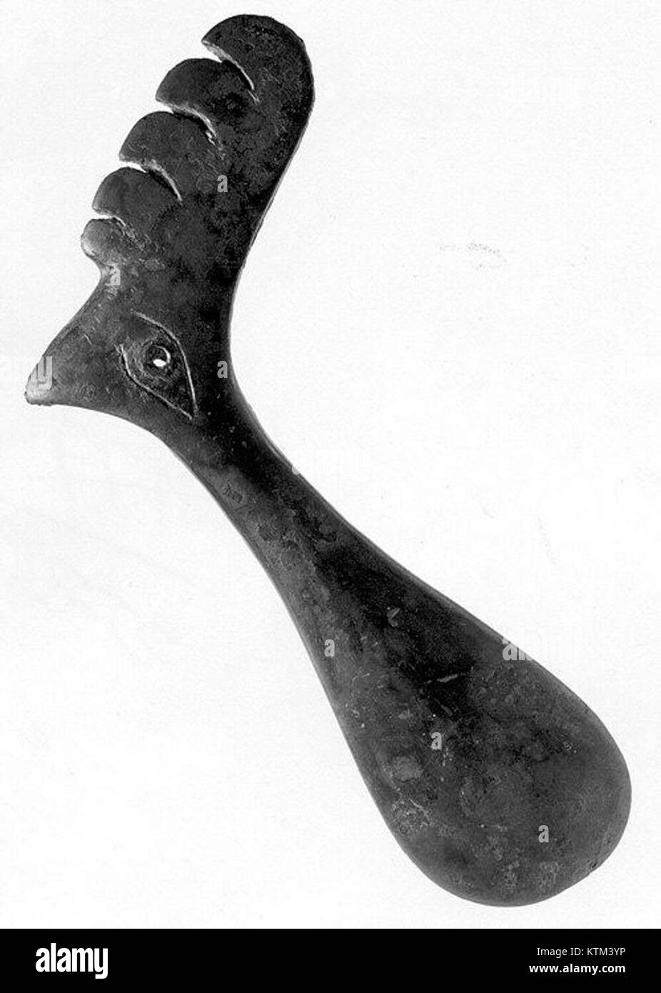 This artifact, identified as an axe with a shaft hole, dates back to an ...