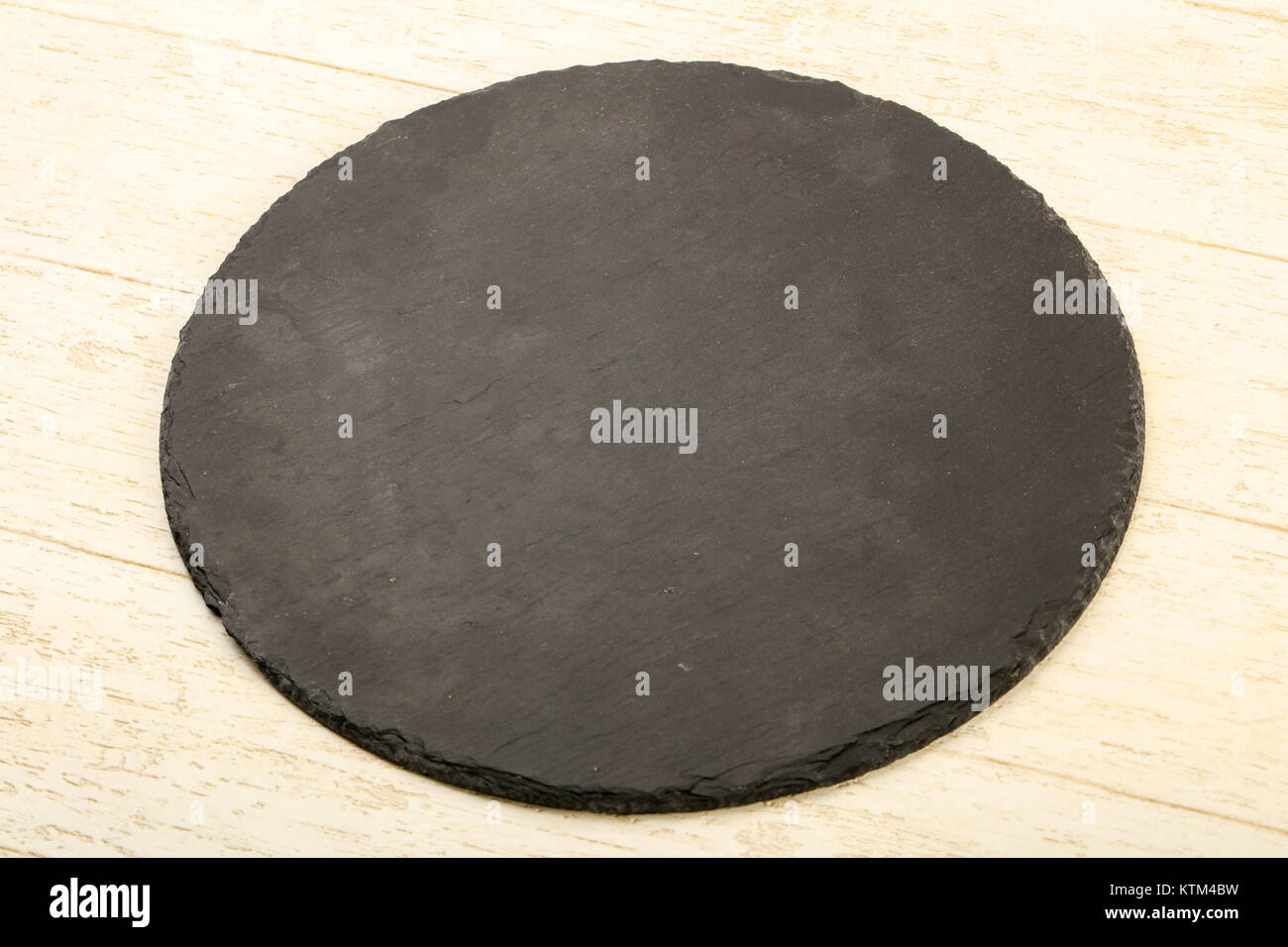 Black stone plate for home and restorant use Stock Photo - Alamy