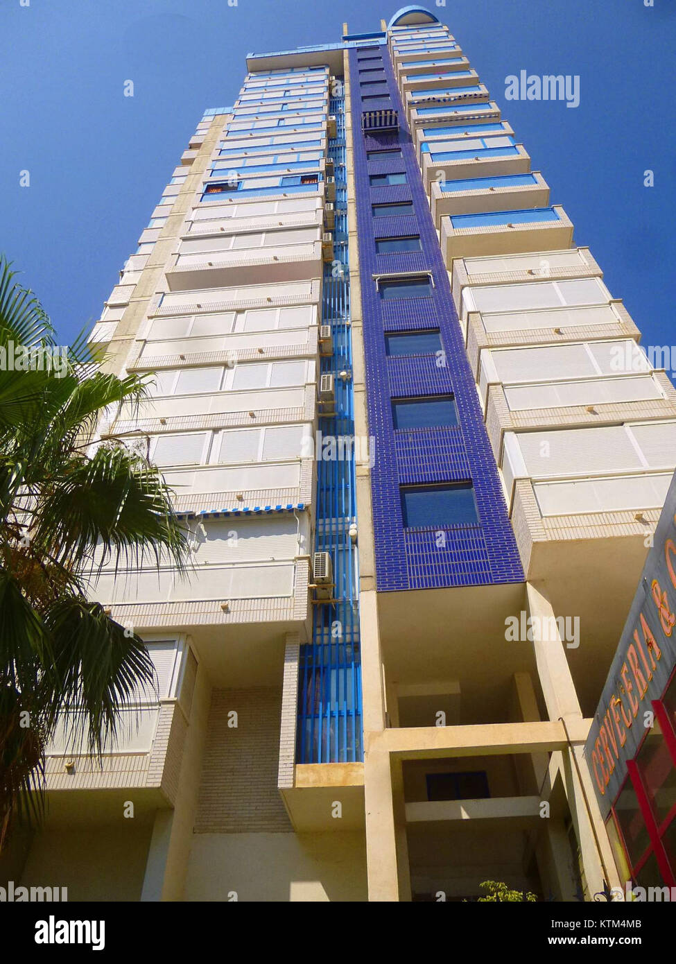 A photograph of the Edificio Kennedy III in Benidorm, Spain. This image captures the modern ...