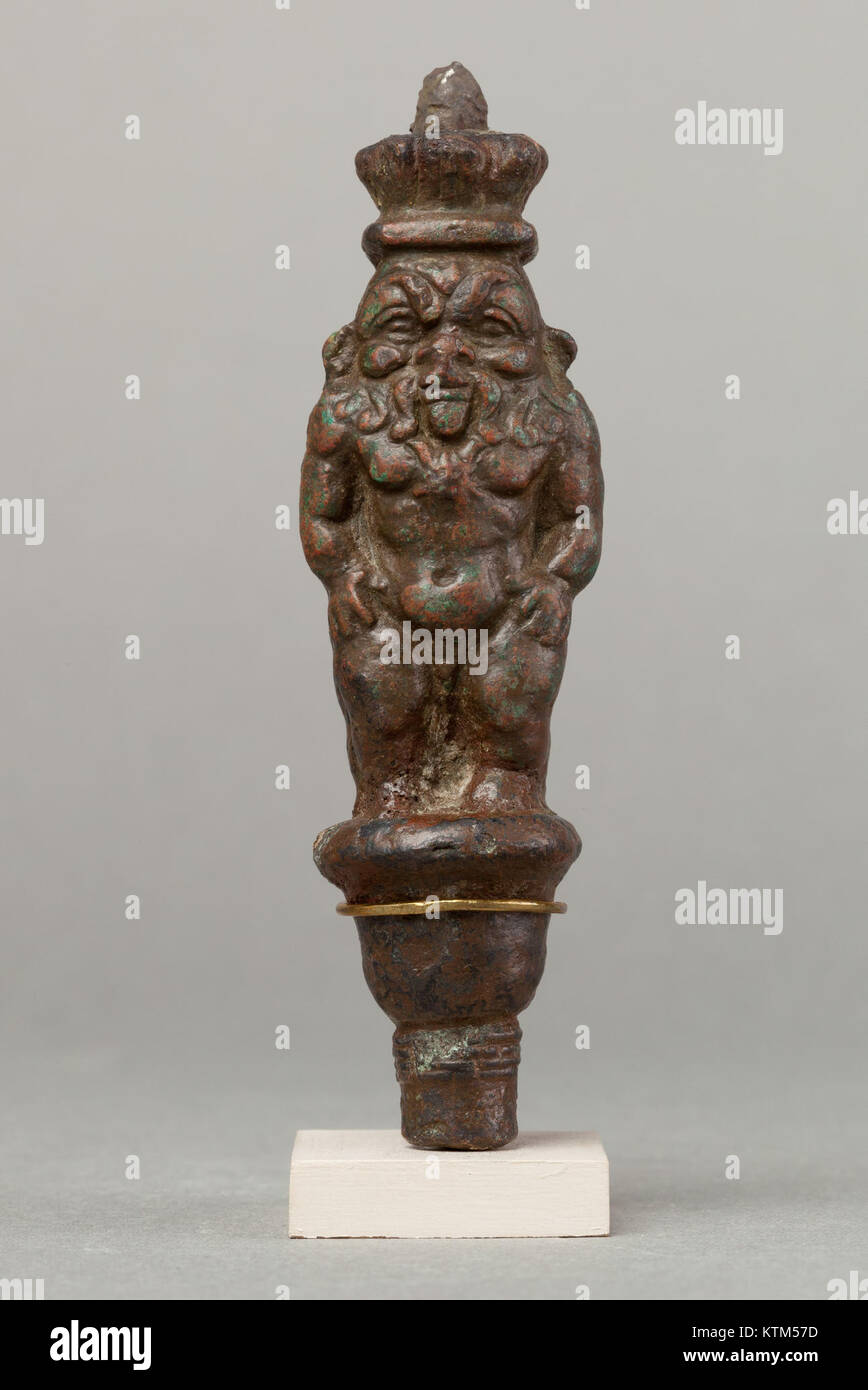 This ancient Egyptian artwork features the deity Bes standing on a ...