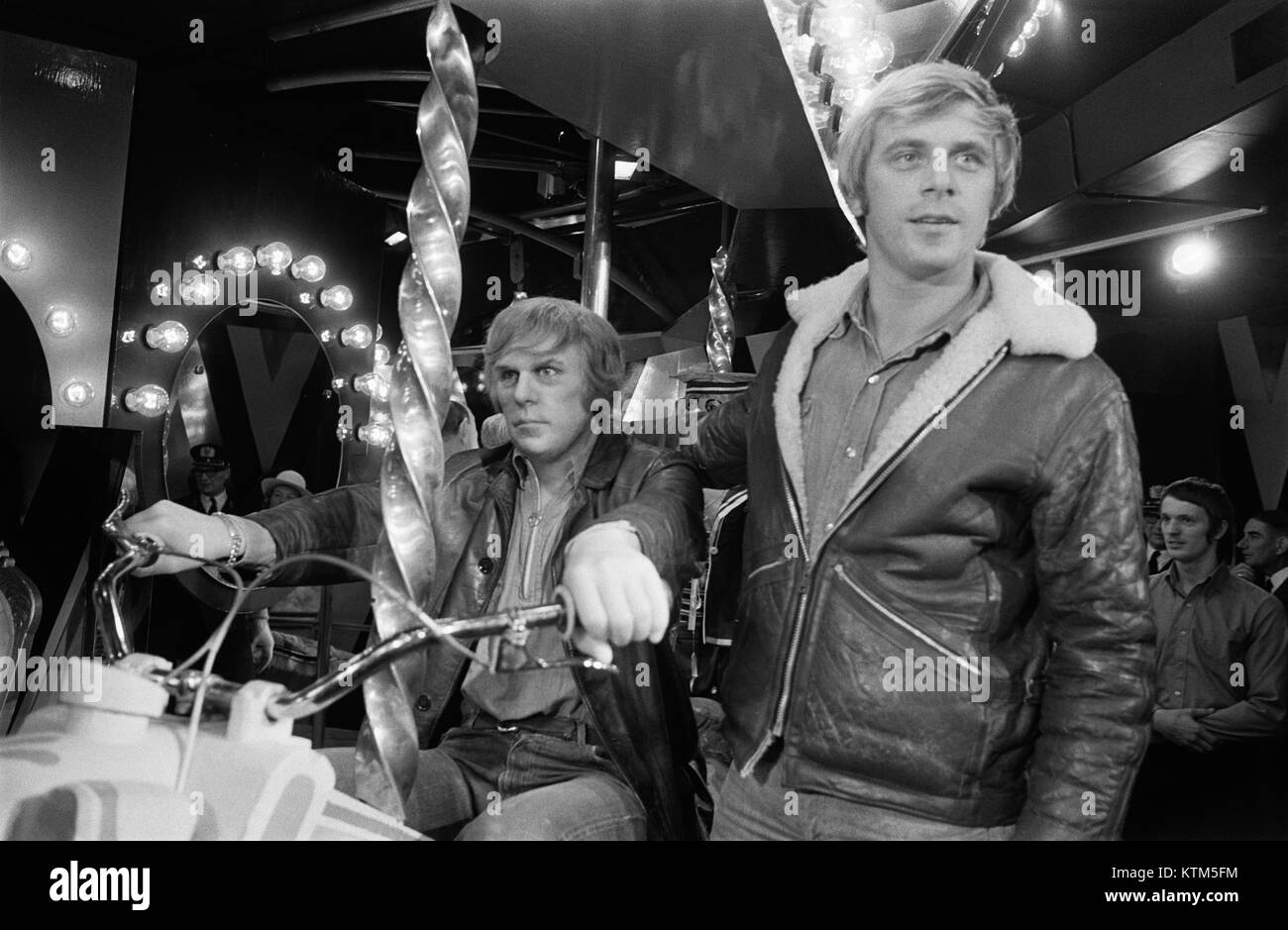 A photo of celebrities viewing their wax figures at the Madame Tussauds ...