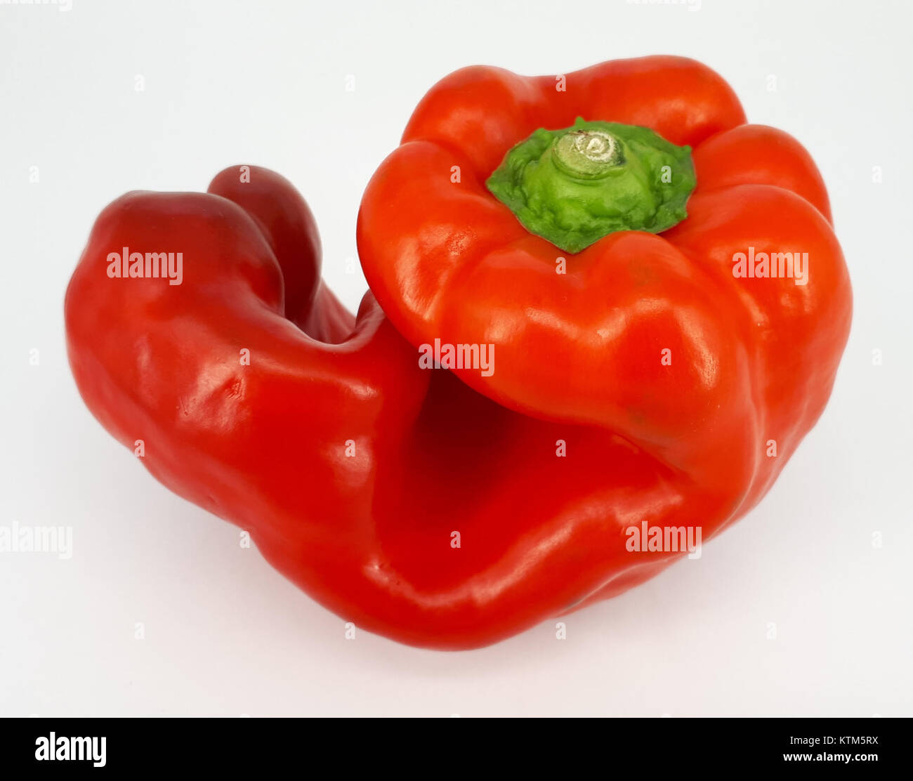 A bent red bell pepper, photographed in 2017, showcasing its natural ...
