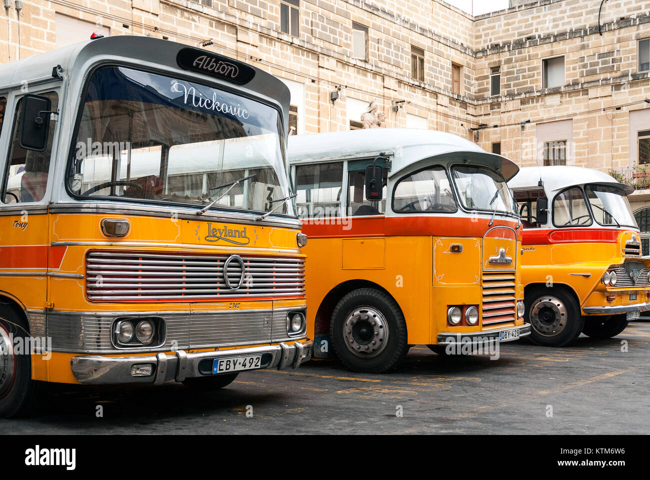 vintage orange british bedford buses on street of la valletta old town ...