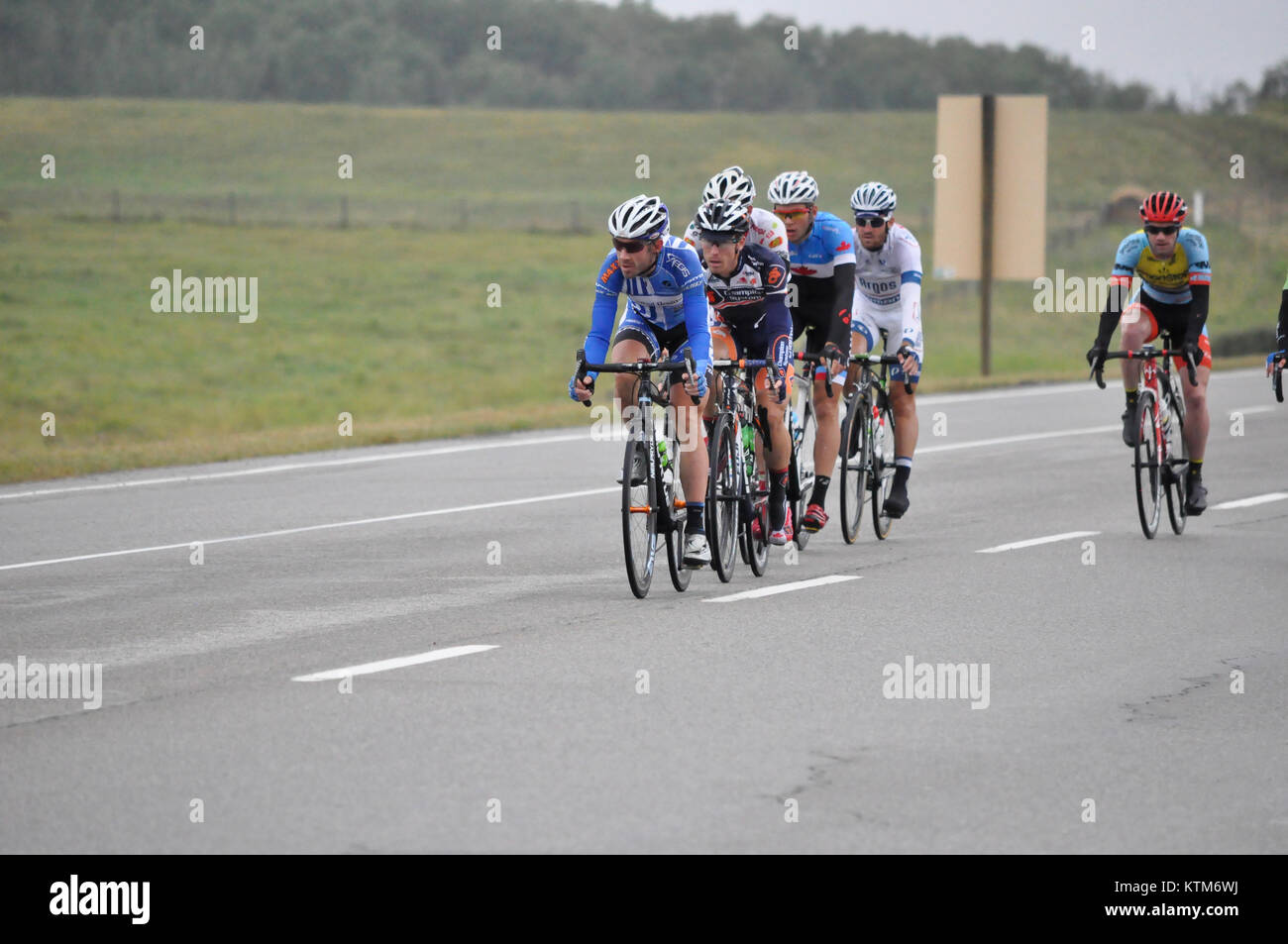 Professional Cyclists in the rainy leg of the Tour of Alberta Pro ...