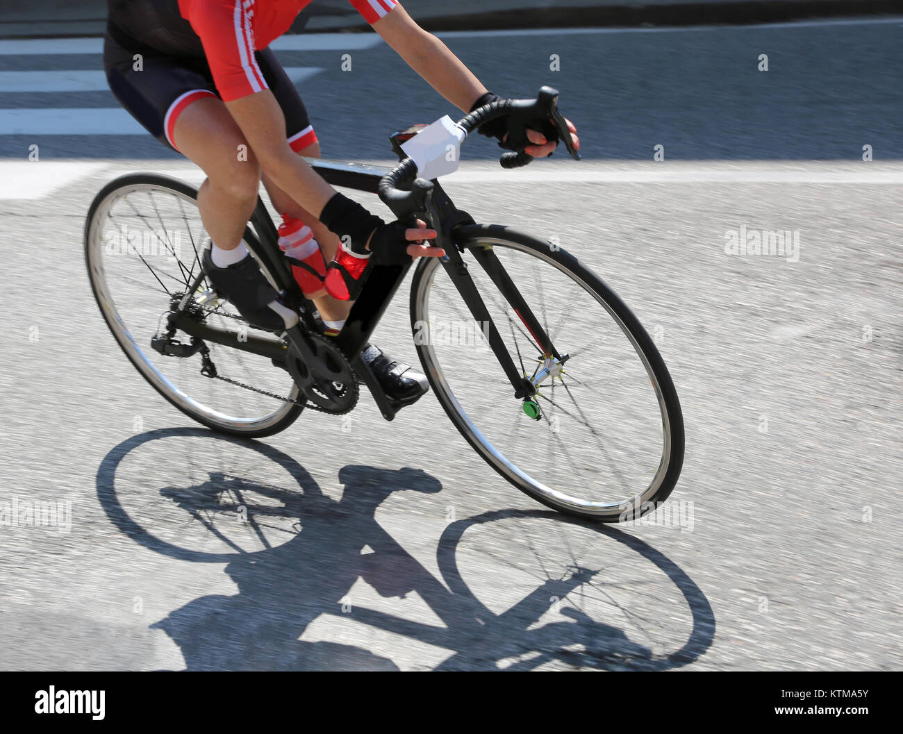 fast cyclist over her bike during the curve on the road Stock Photo - Alamy