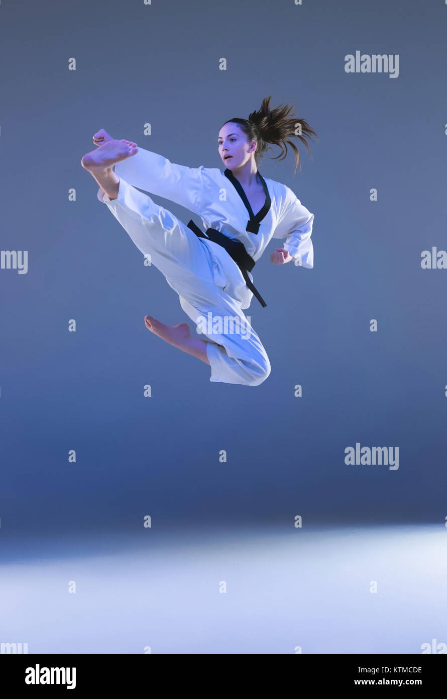 The karate girl with black belt Stock Photo - Alamy