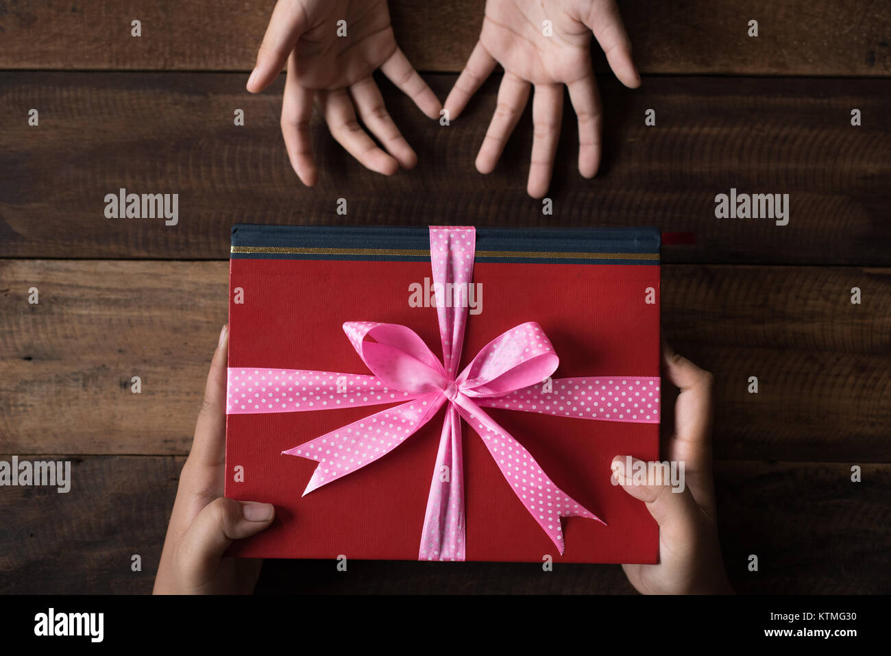 giving a book as a present. give a book day Stock Photo - Alamy