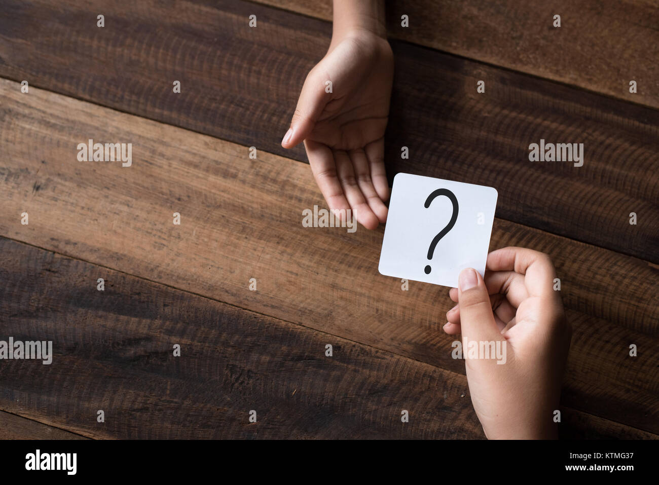 hand giving a note written question mark. asking question concept Stock ...