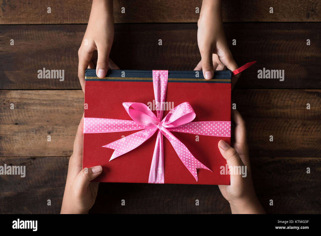 giving a book as a present. give a book day Stock Photo - Alamy